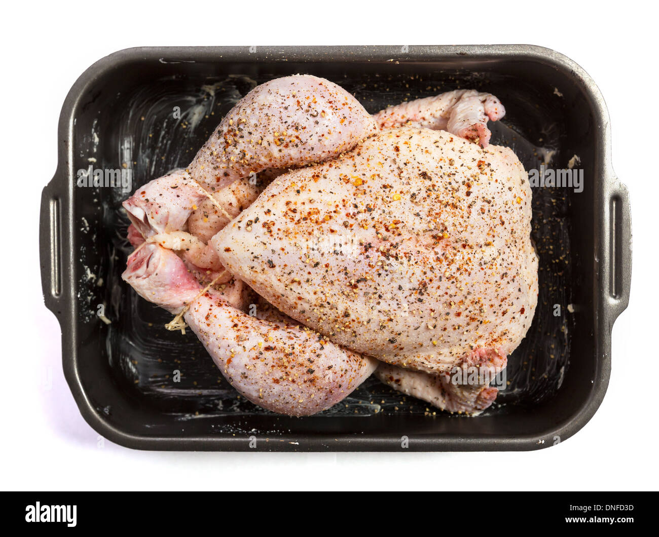 Raw chicken ready to be roasted Stock Photo - Alamy