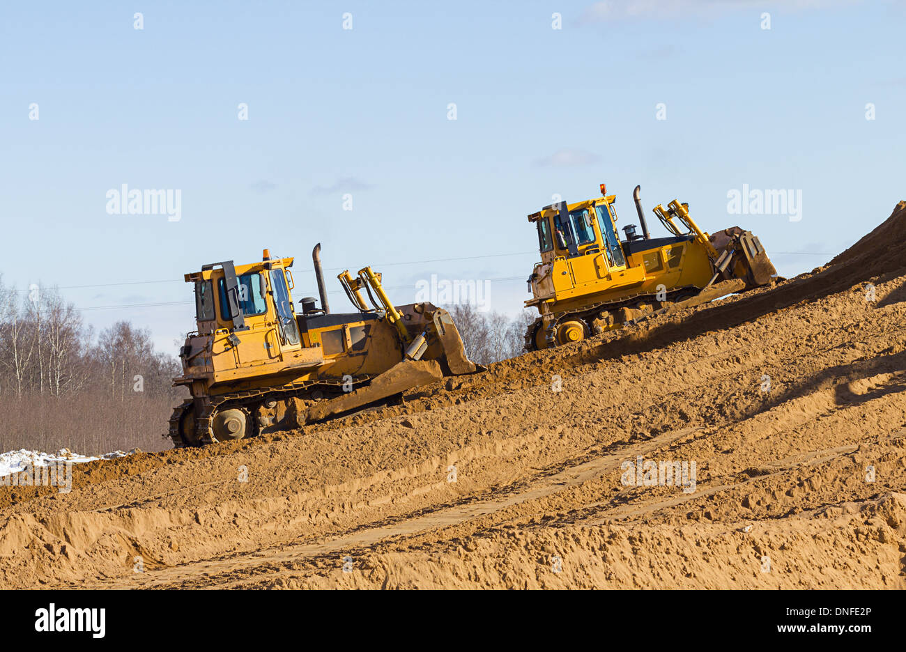 Yellow construction transport Stock Photo - Alamy