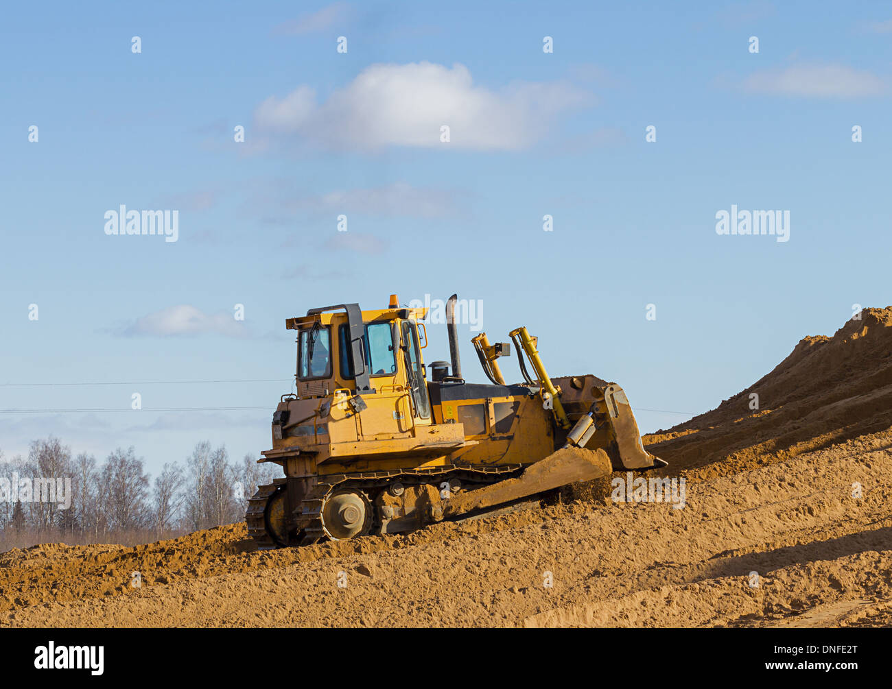 Yellow construction transport Stock Photo - Alamy
