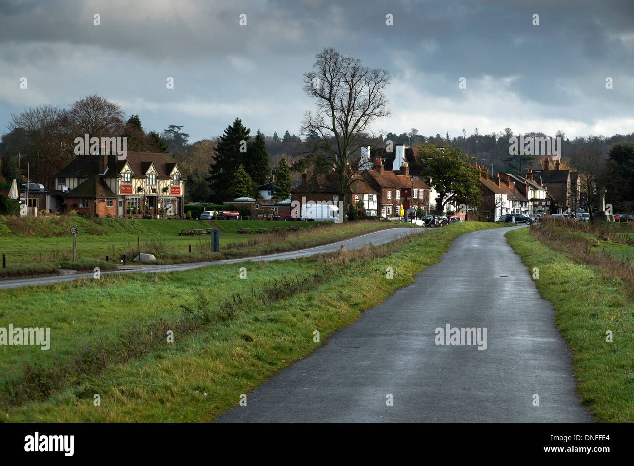 Winter scene: wet tarmac footpath towards Cookham village, Cookham Moor ...