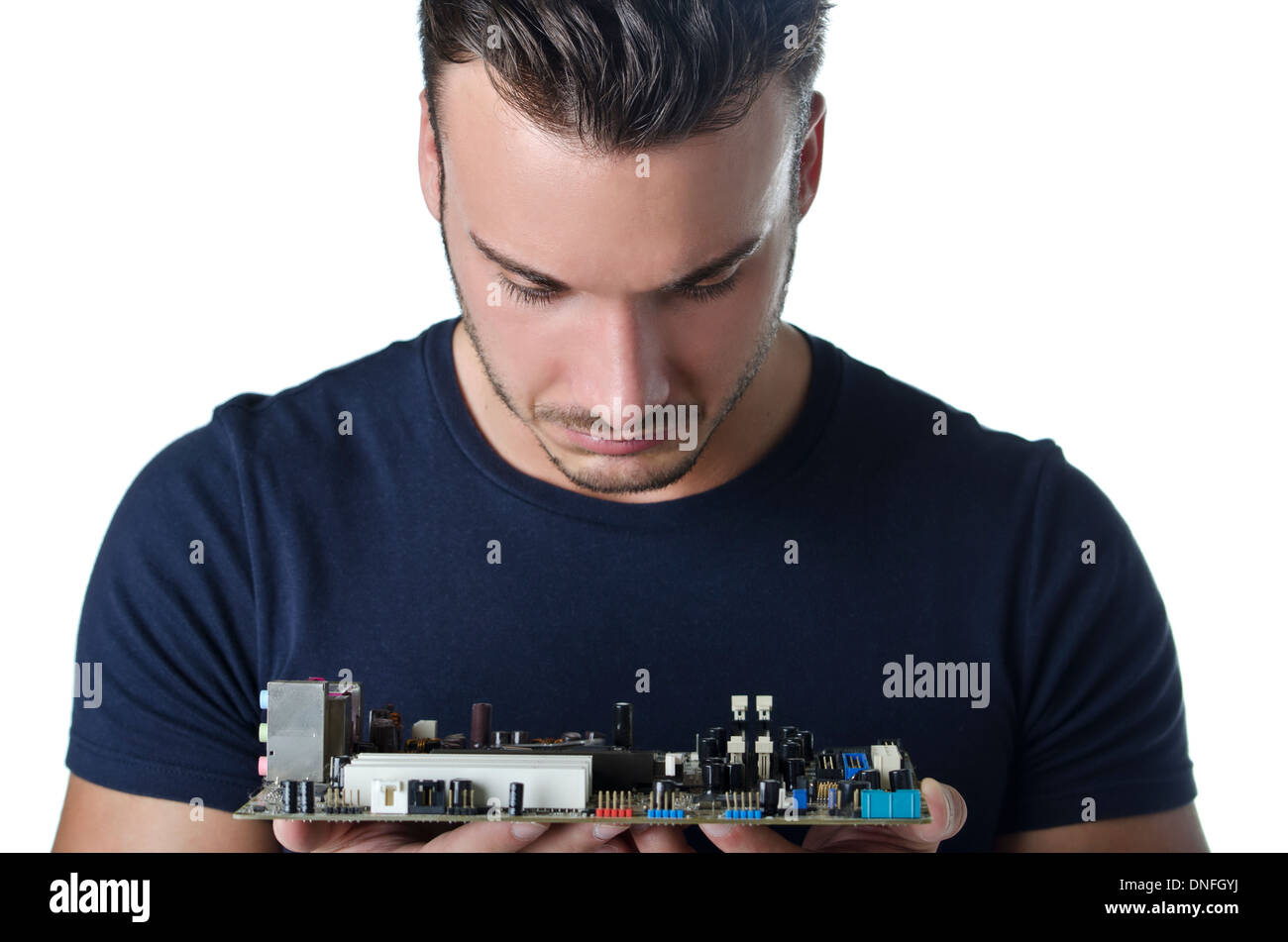 Confused, puzzled technician looking at computer motherboard Stock ...