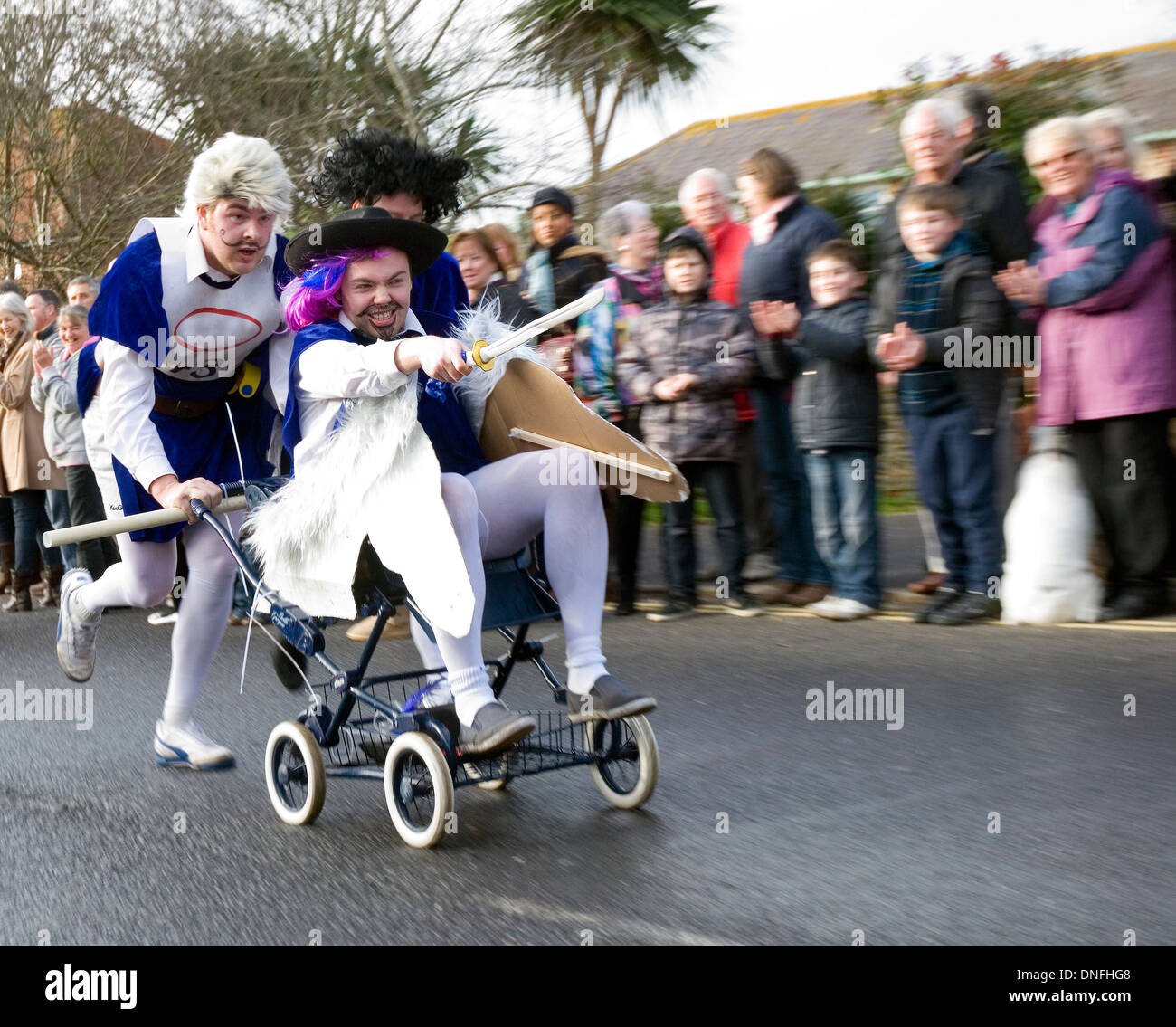 Men dressed in fancy dress as pirates push their pram in the Pagham ...