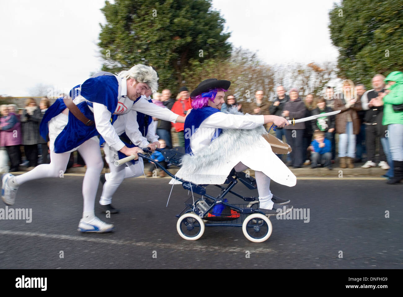 Men dressed in fancy dress as pirates push their pram in the Pagham ...