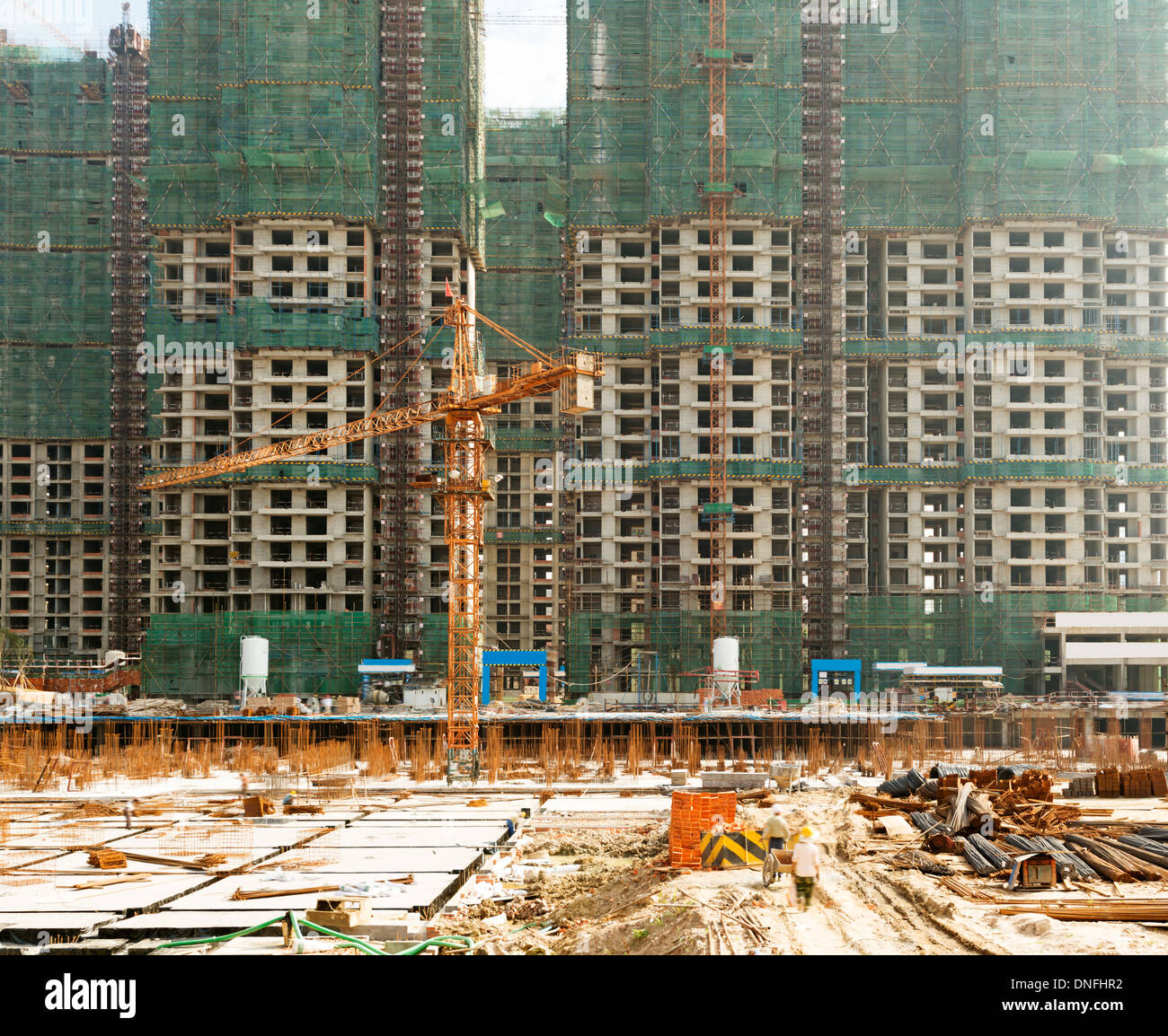 building under construction with workers Stock Photo - Alamy