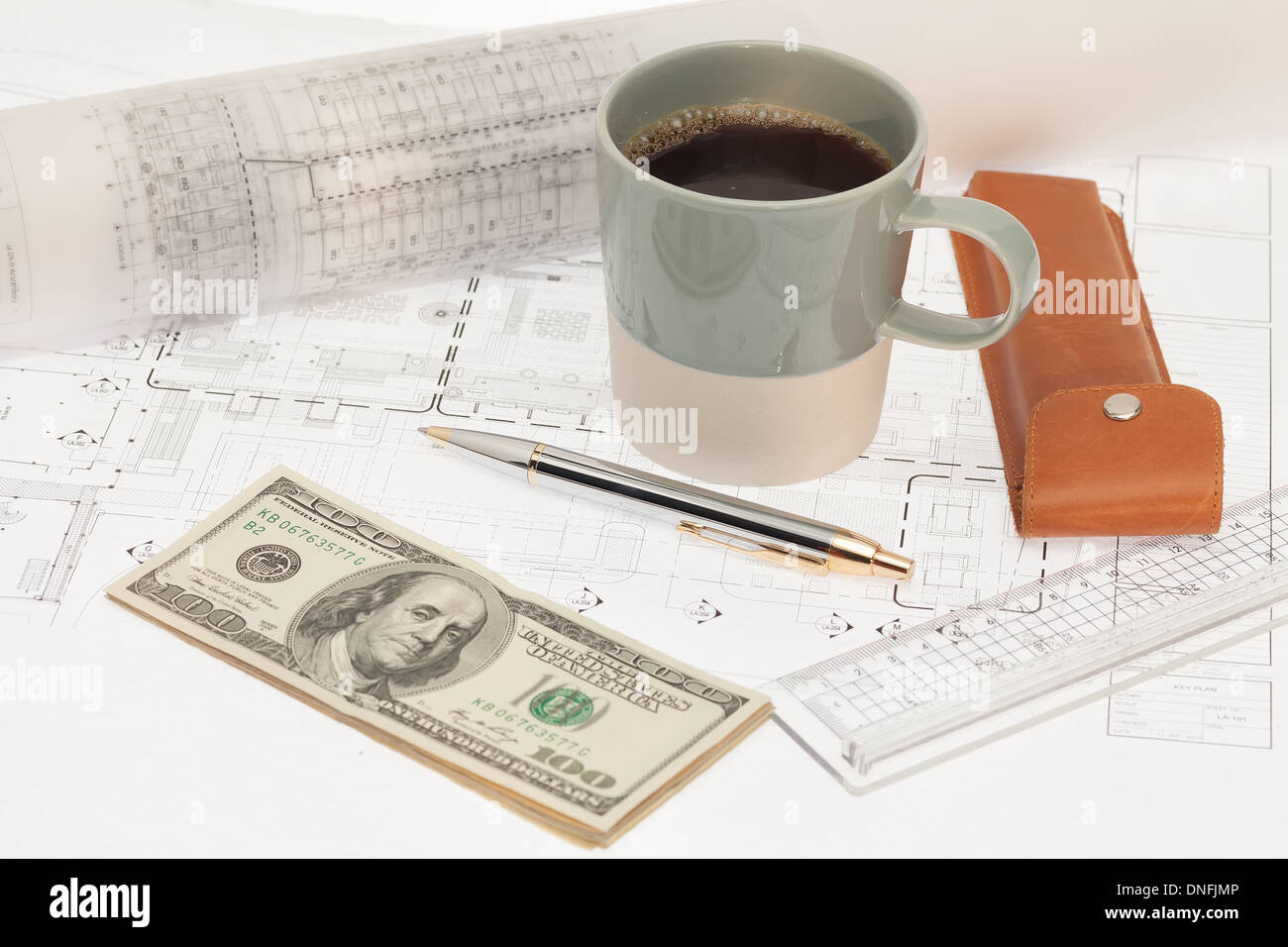 Architectural cad drawing with coffee cup and money Stock Photo - Alamy
