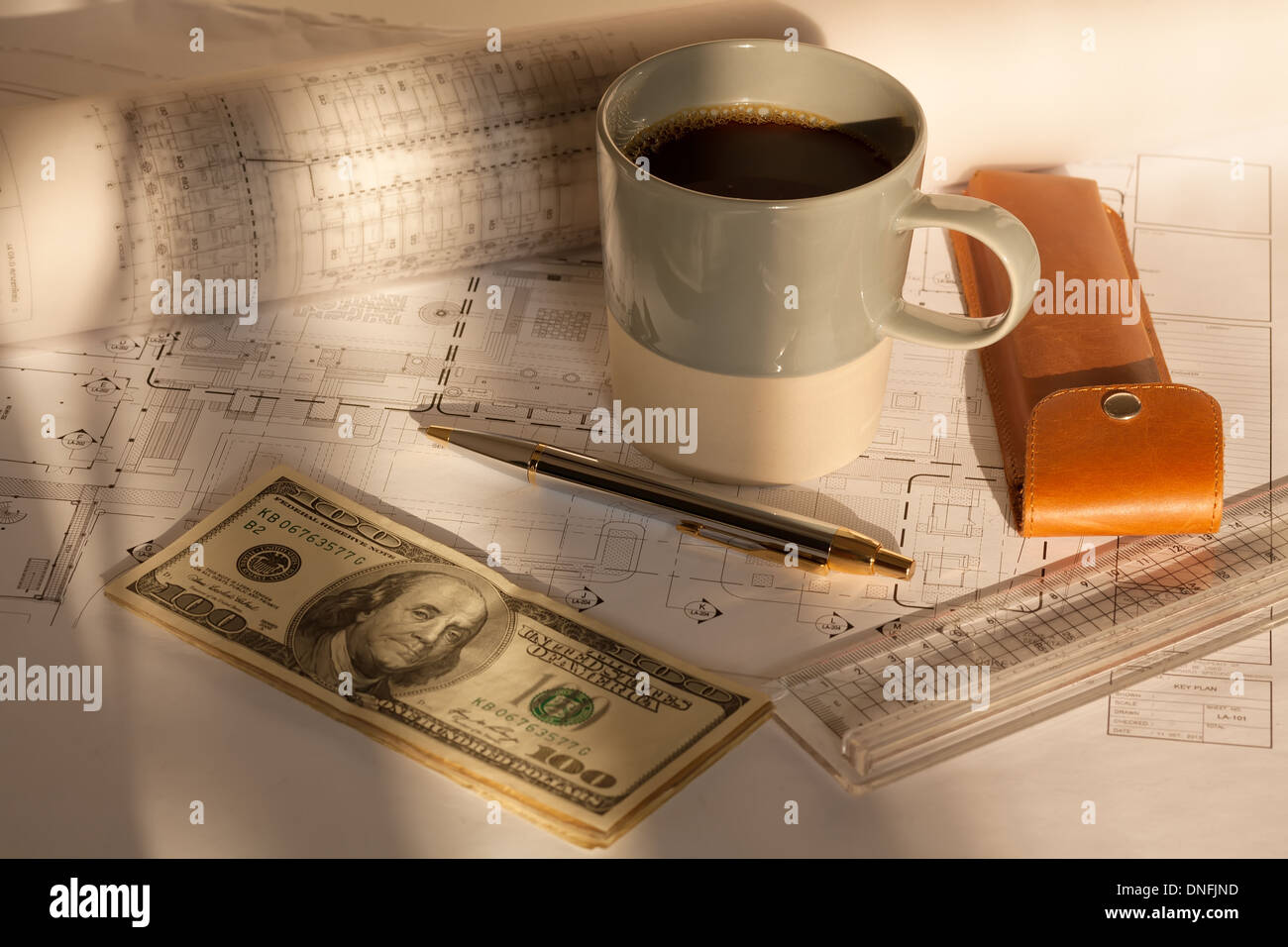 Architectural cad drawing with coffee cup and money Stock Photo - Alamy