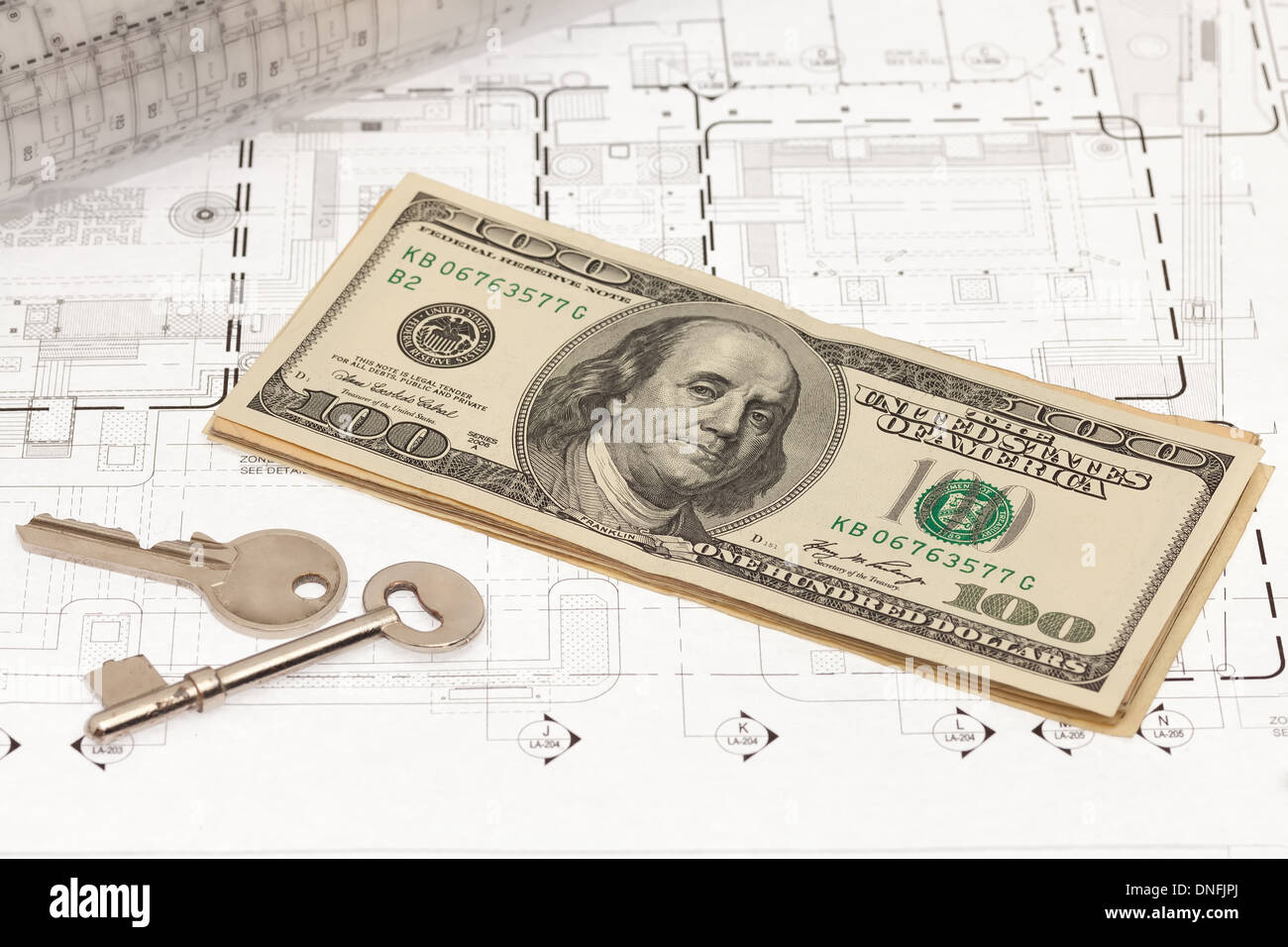 Architecture project with money and key Stock Photo - Alamy