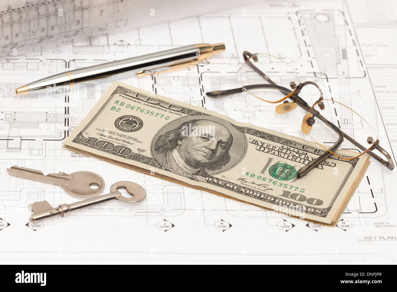 Engineering project planning with blueprint and cash Stock Photo - Alamy