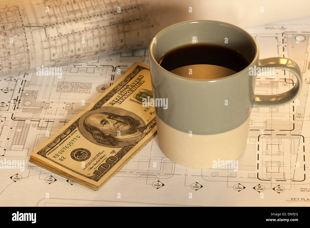 Coffee cup and money on architectural design and cad drawing Stock ...