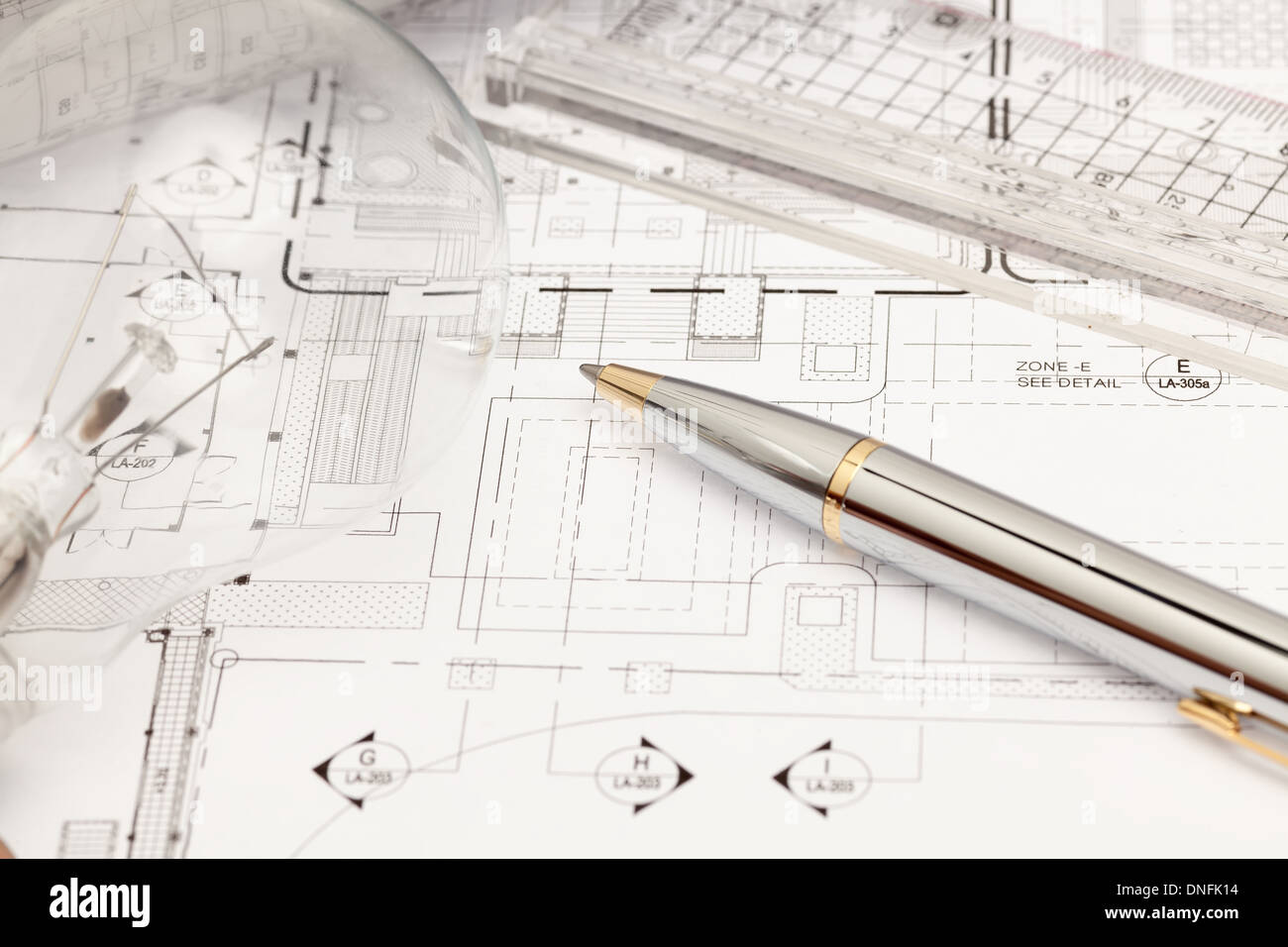 Design and idea with drawing and light bulb Stock Photo - Alamy