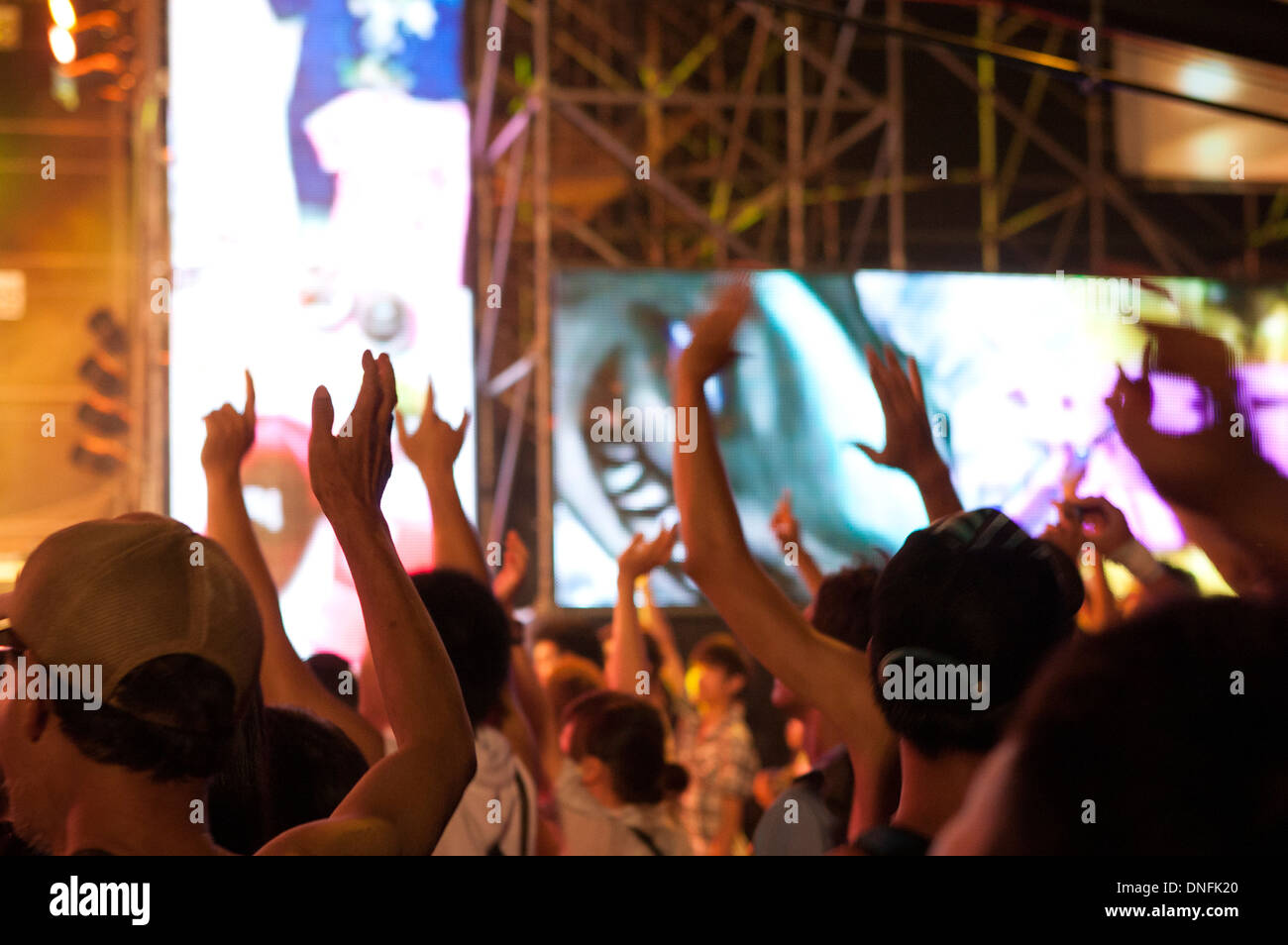 Excited audience in popular music concert Stock Photo - Alamy