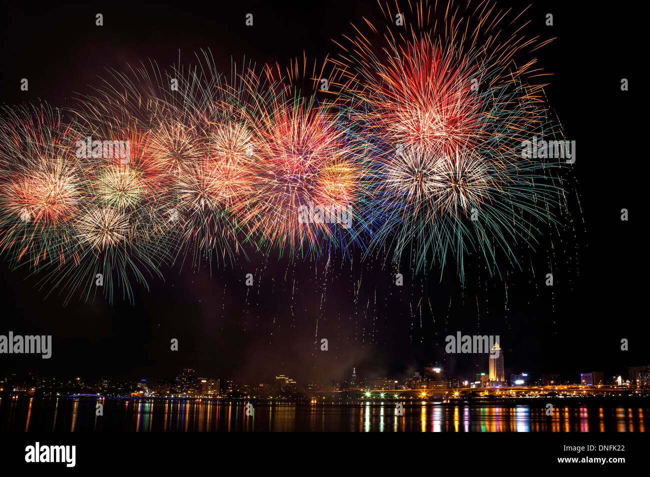 Fireworks at night above city Stock Photo - Alamy