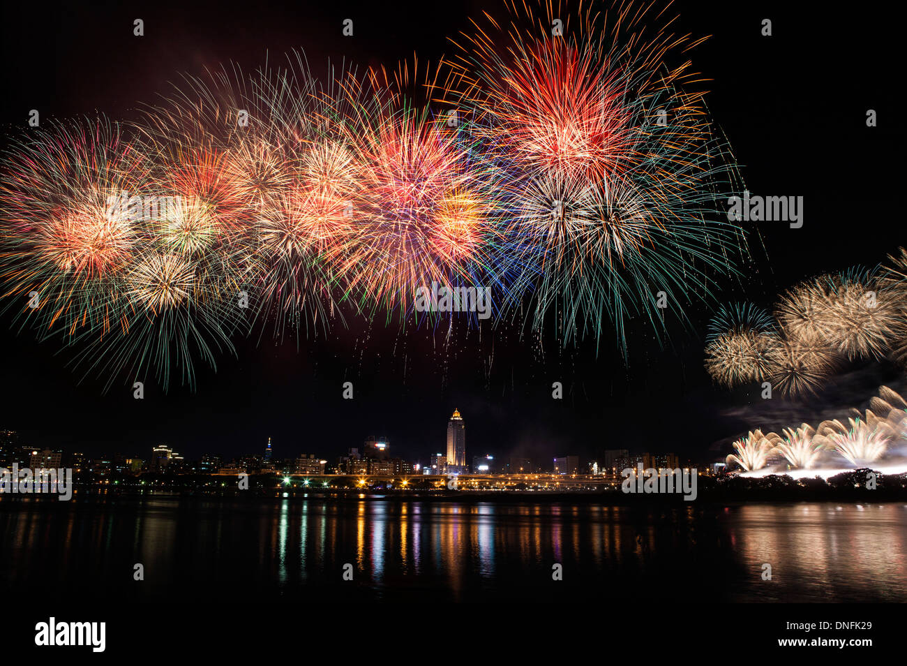 Fireworks at night above city Stock Photo - Alamy