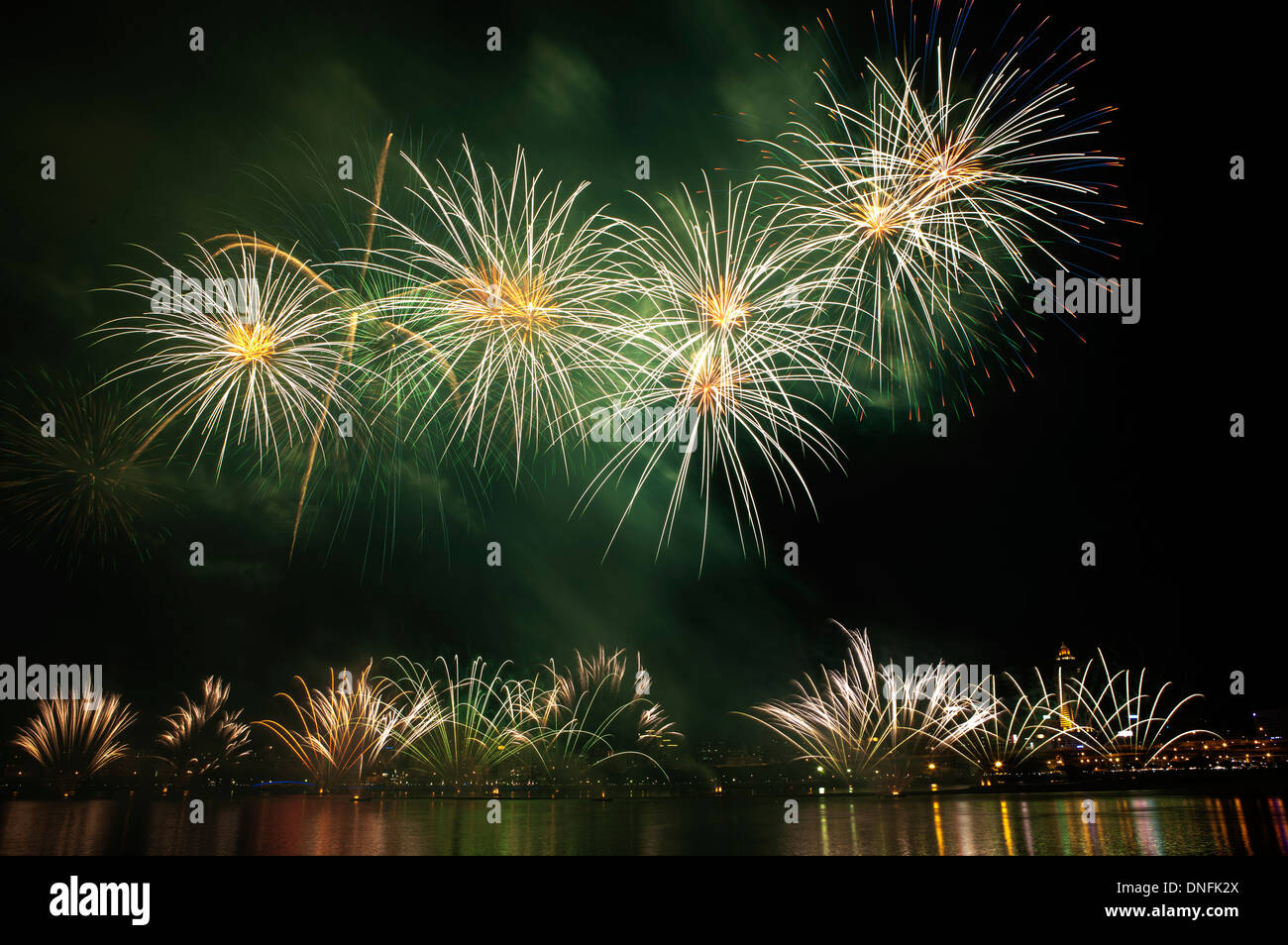 Fireworks at night over water Stock Photo - Alamy
