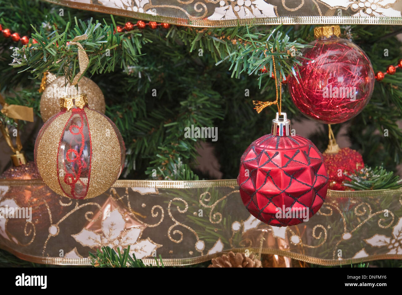 Traditional festive decorations on the evergreen tree to celebrate ...