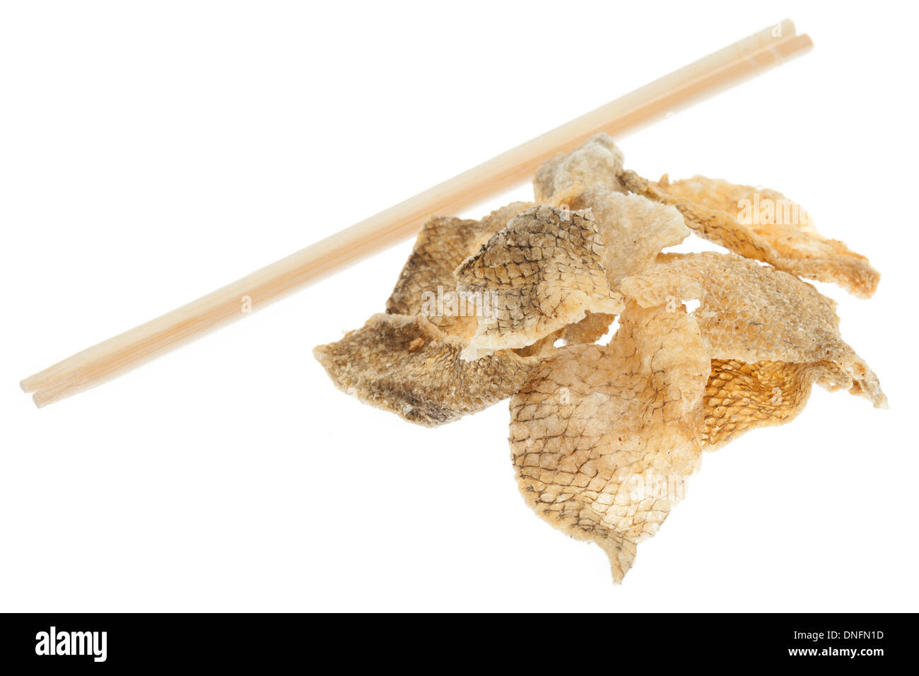 Crispy fried fish skin isolated on white background Stock Photo - Alamy