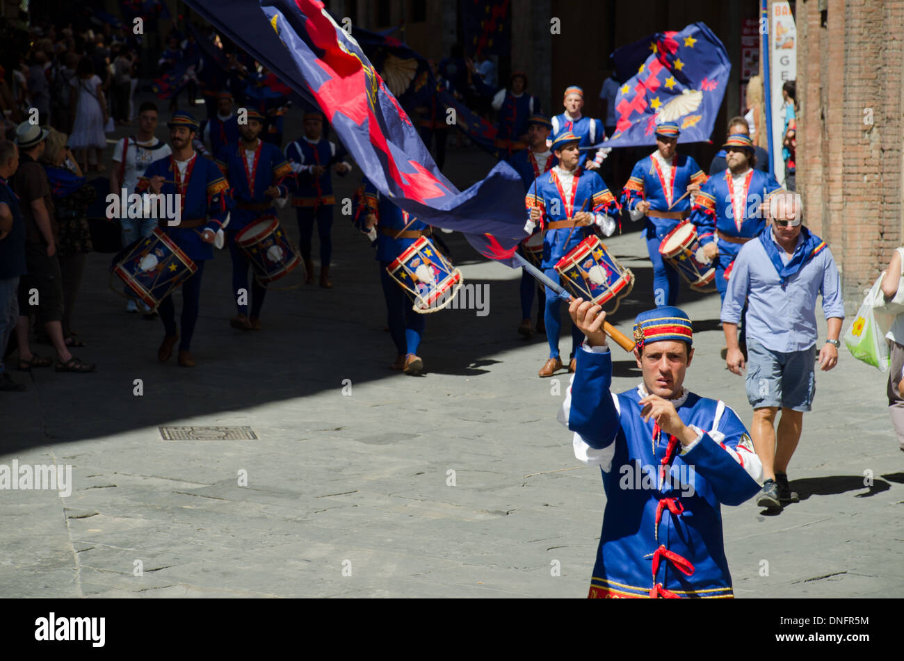 Young bannerman waving flag with heroism, Italian parade (parata) in ...