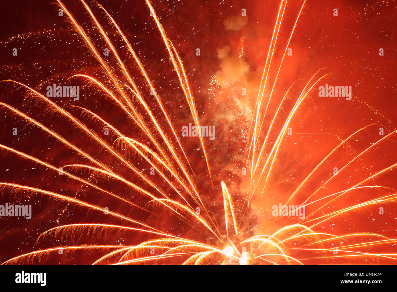 red abstract holiday background with fireworks Stock Photo - Alamy