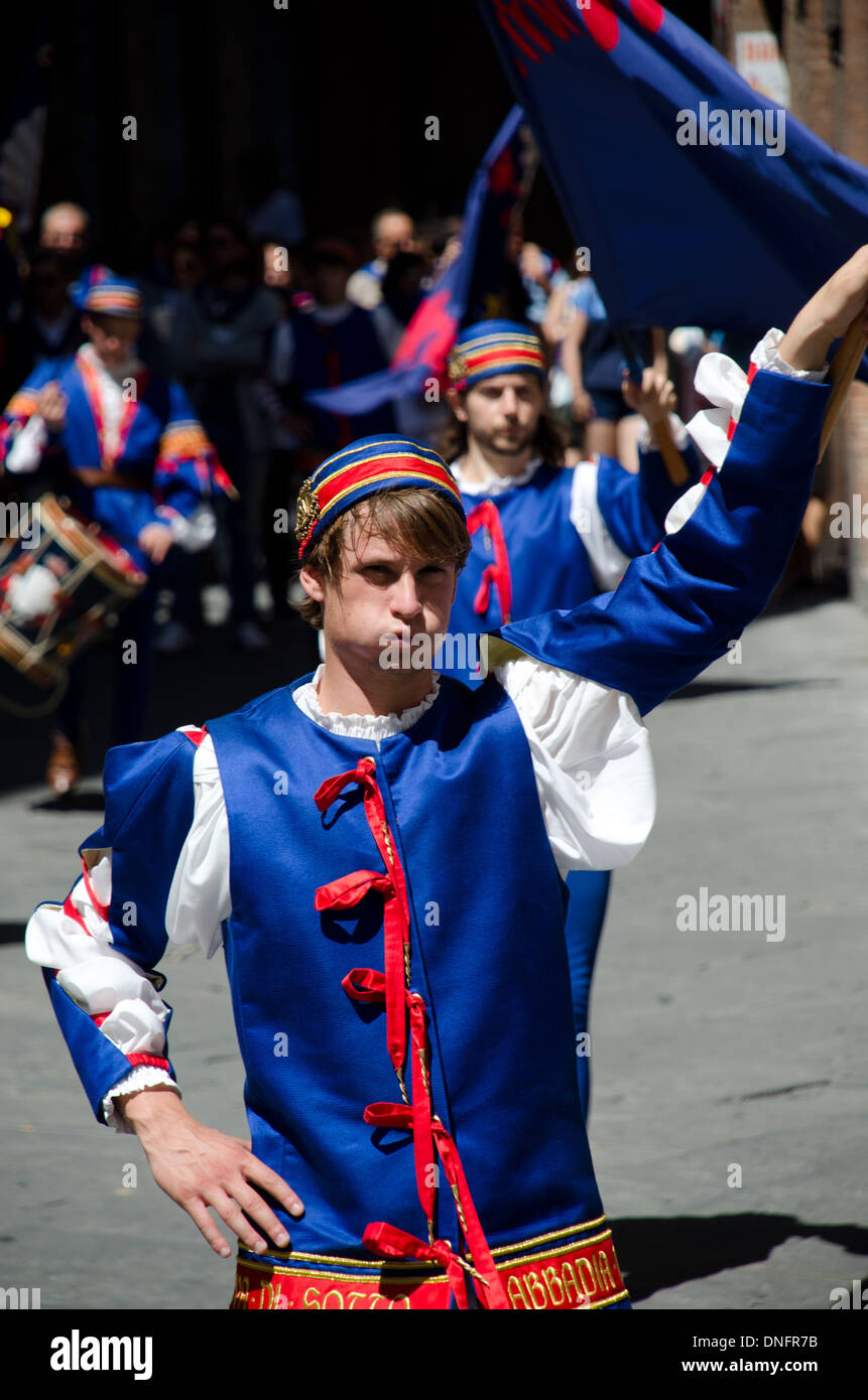 Young bannerman waving flag with heroism, Italian parade (parata) in ...