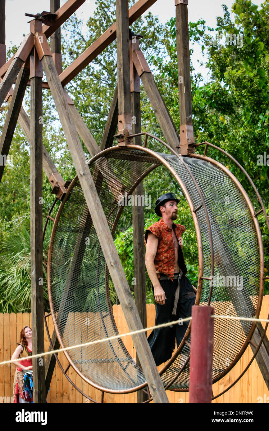 Circus performer entertaining the public with his hamster wheel Stock ...