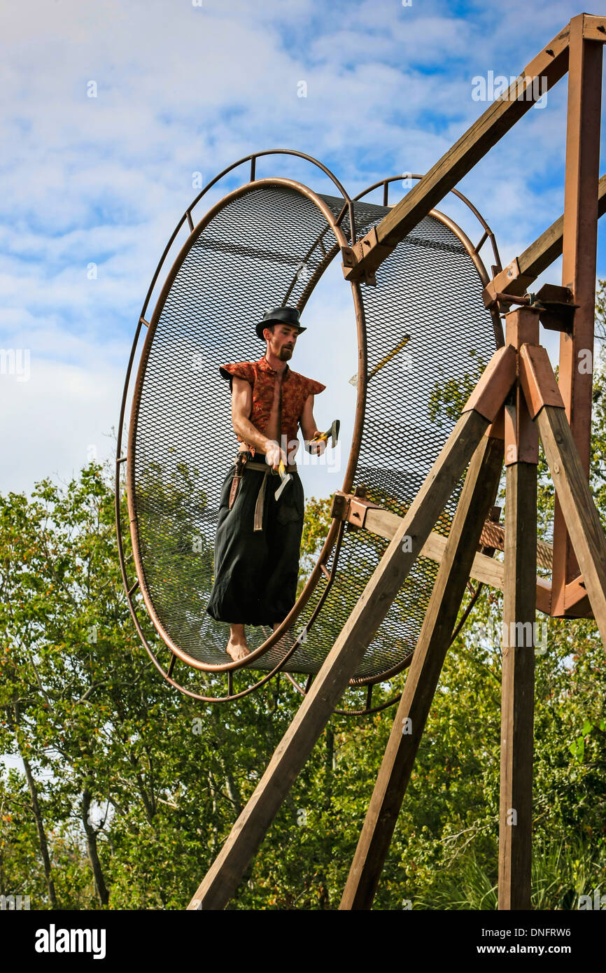 Circus performer entertaining the public with his hamster wheel Stock ...