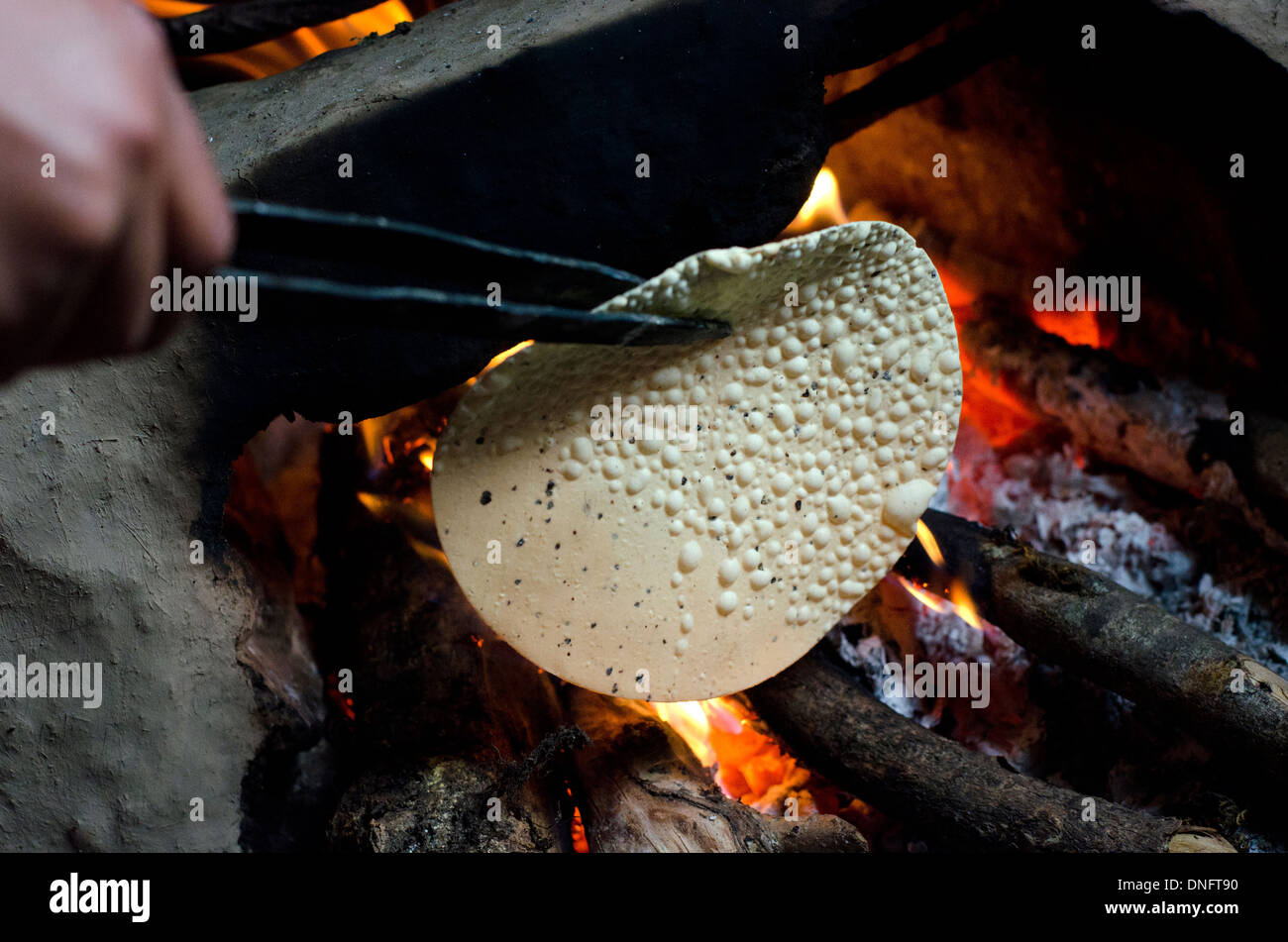 Cooking traditional Nepali Roti bread Stock Photo - Alamy
