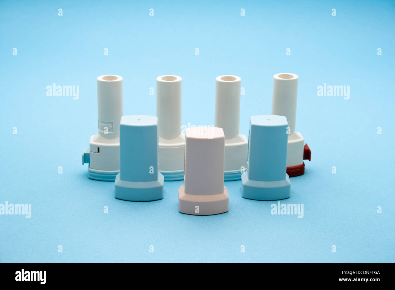 Different Asthma Inhaler on blue background Stock Photo - Alamy