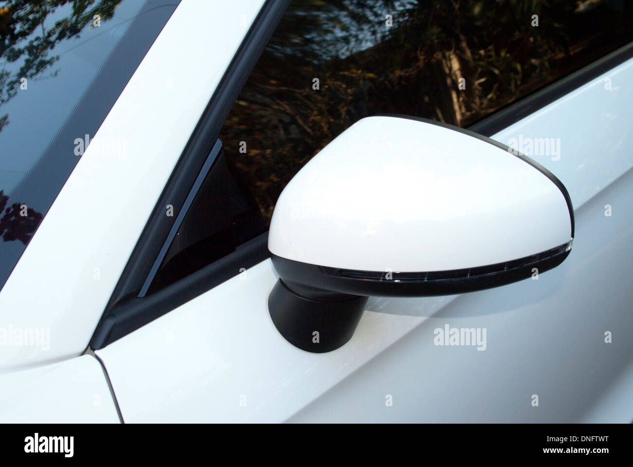 Abstract closeup side view of rear-view mirror and vehicle Stock Photo ...