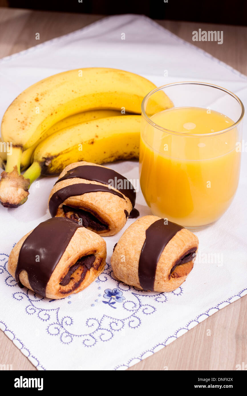 neapolitan chocolate and fruit banana on wood background Stock Photo ...