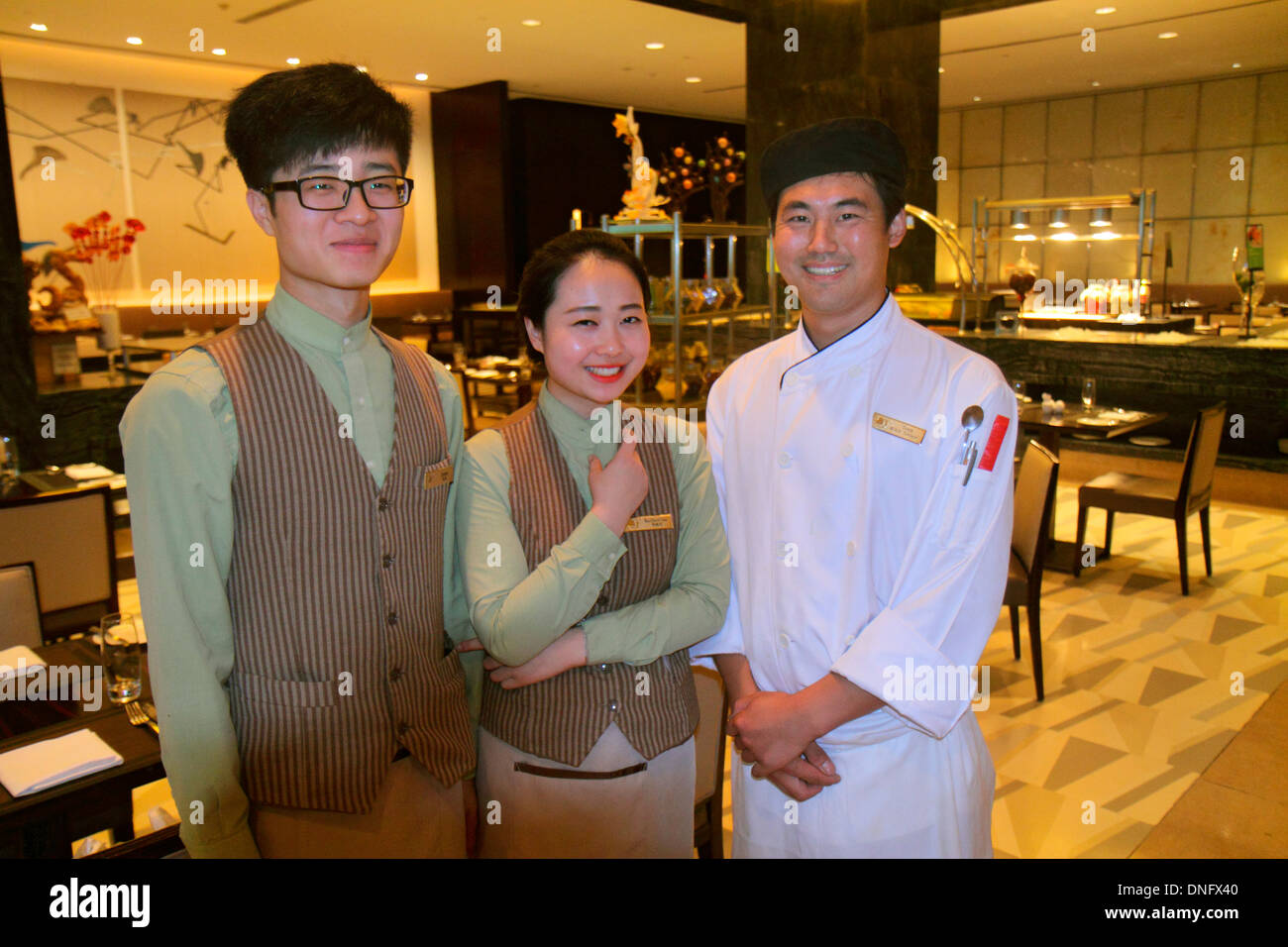 Waitress in chinese restaurant in hi-res stock photography and images ...
