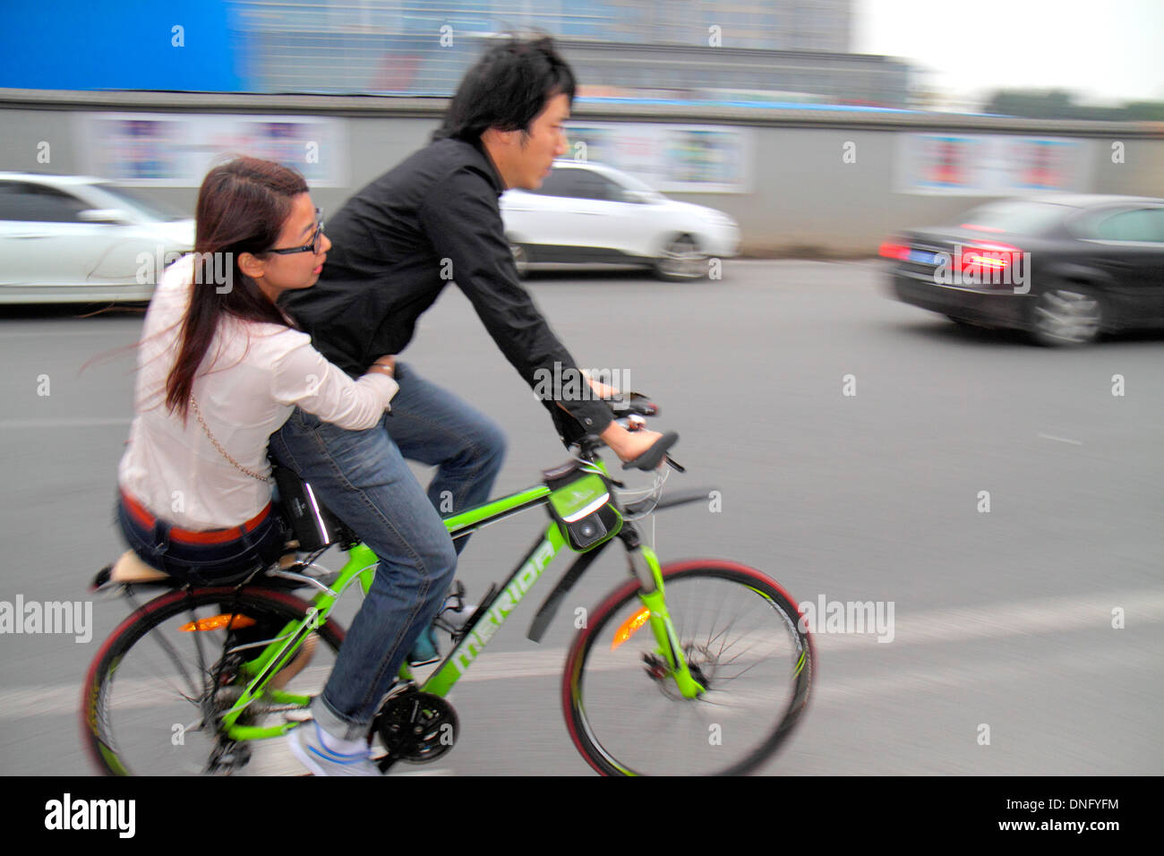 Chinese women riding bicycle hi-res stock photography and images - Alamy