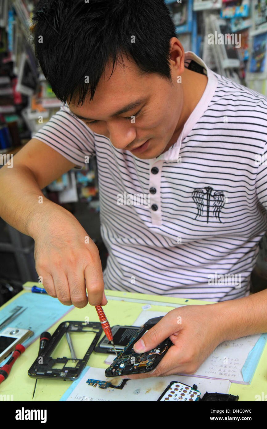 Man taking his mobile phone for repair hi-res stock photography and ...