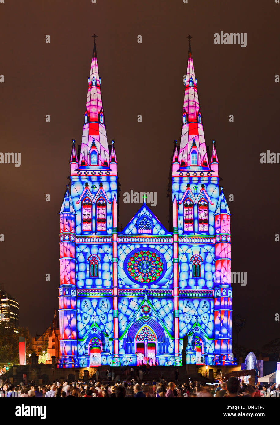 Catholic tall stone cathedral with 2 towers highlighted by light show ...
