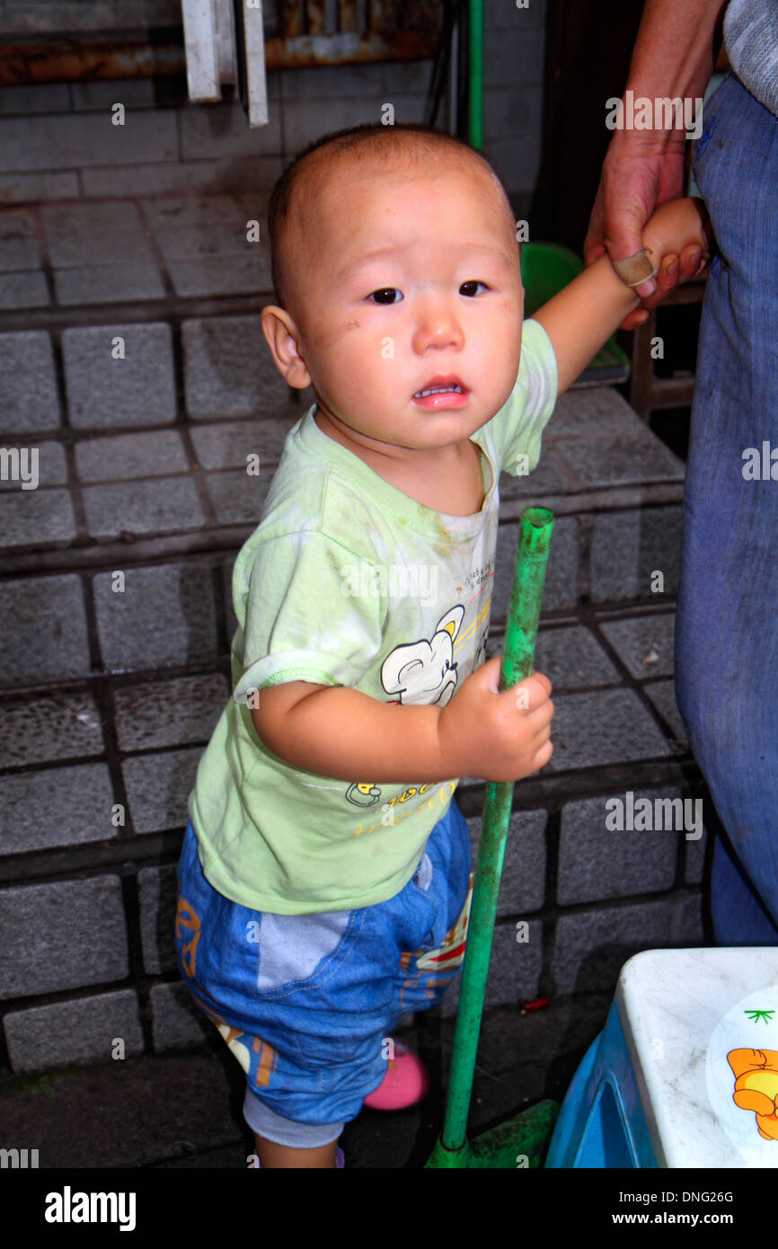 Asian boys hand hi-res stock photography and images - Alamy
