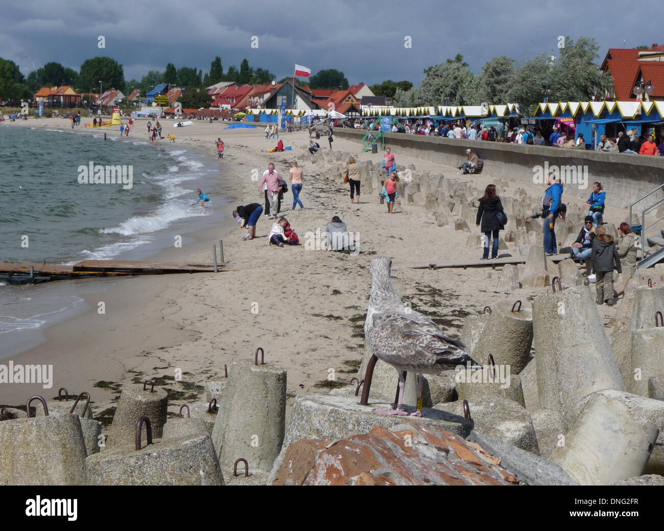 Tourists at the beach of the fishing village Hel at penisula Hel in ...
