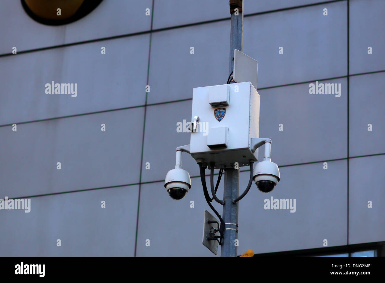 An NYPD security camera mounted on a lampost high above the street ...