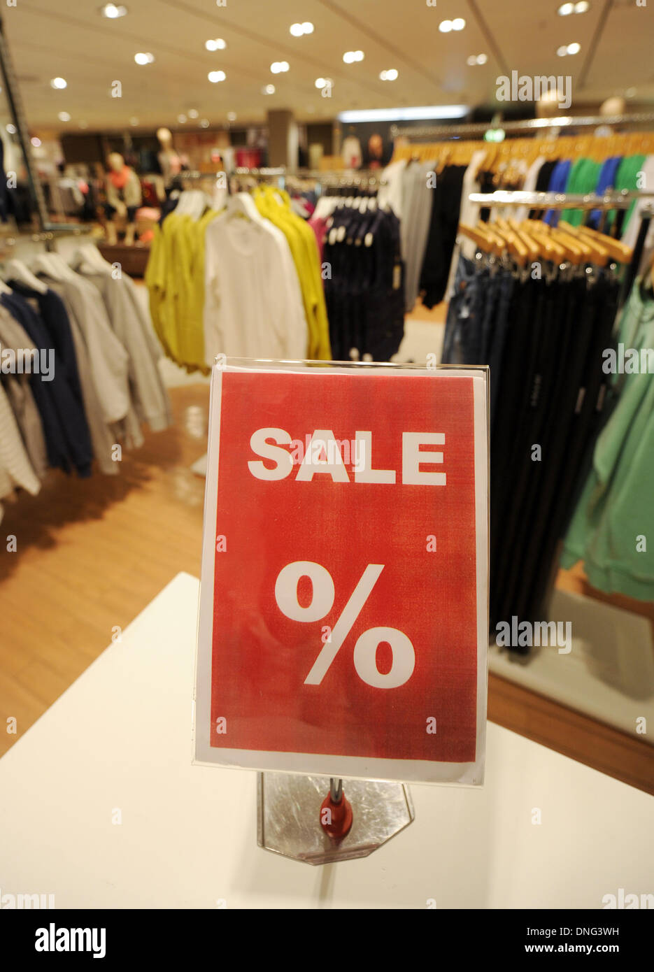 A "sale" sign in on a display for women's clothing in a design store in ...