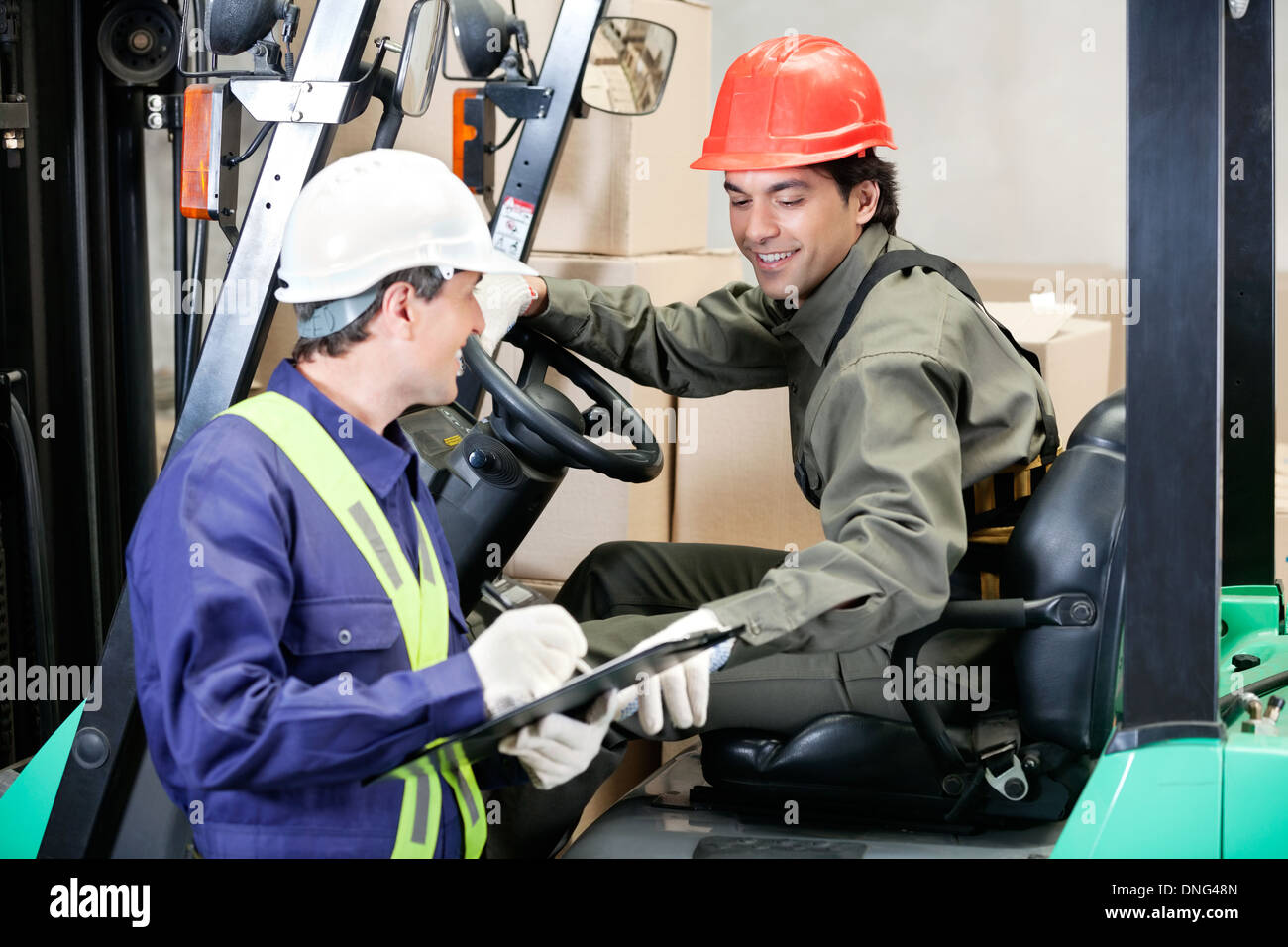 Man standing fork lift truck hi-res stock photography and images - Alamy