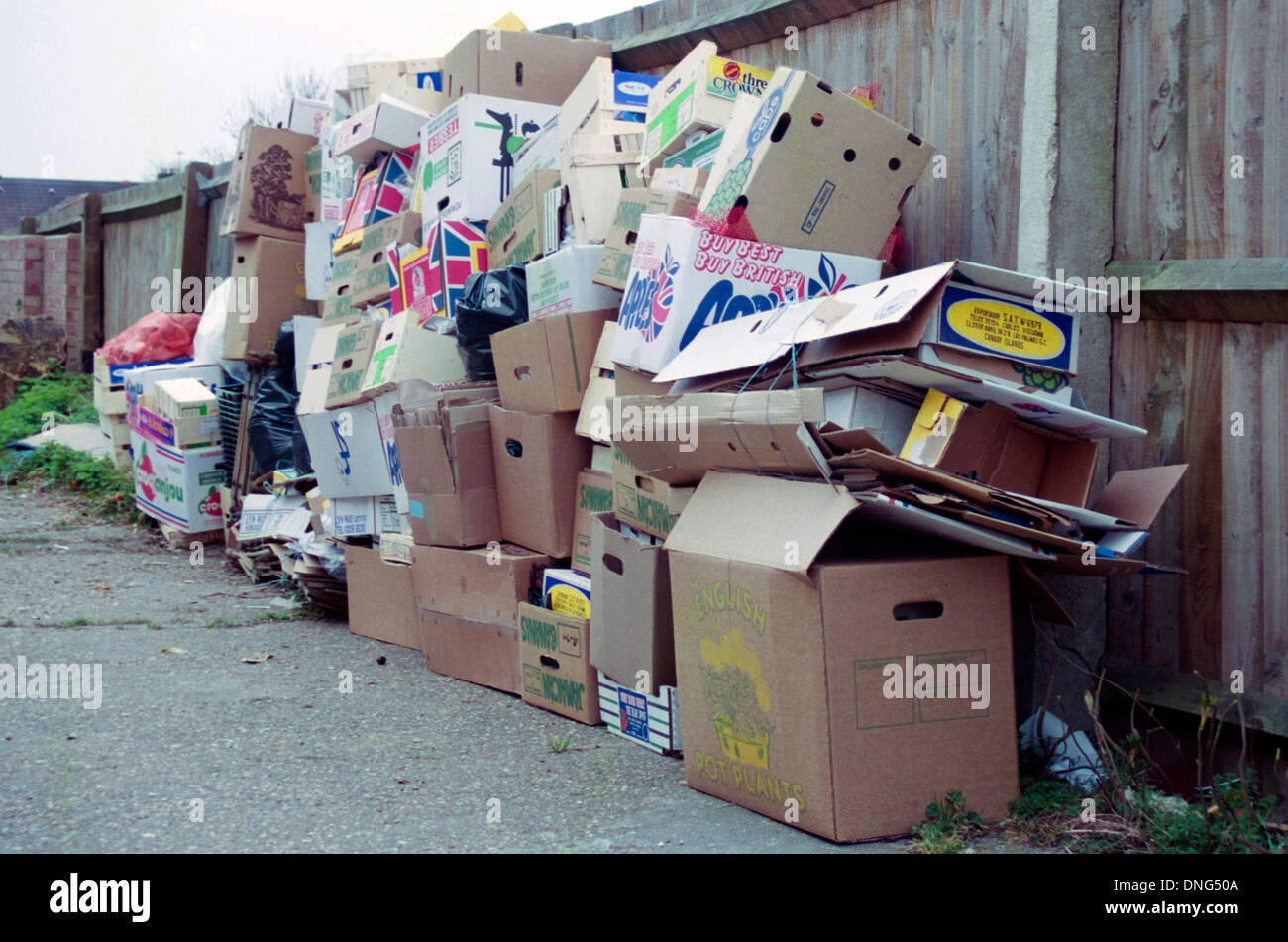 stacks of cardboard piled up and awaiting for collection for disposal ...