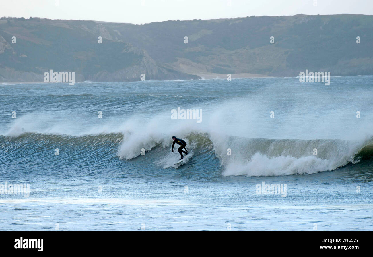 Gower Peninsula - South Wales - UK - 27th December 2013 : A surfer ...