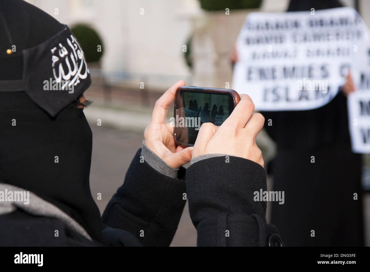 London, December 27th 2013. Anjem Choudary's hard line Muslim followers ...