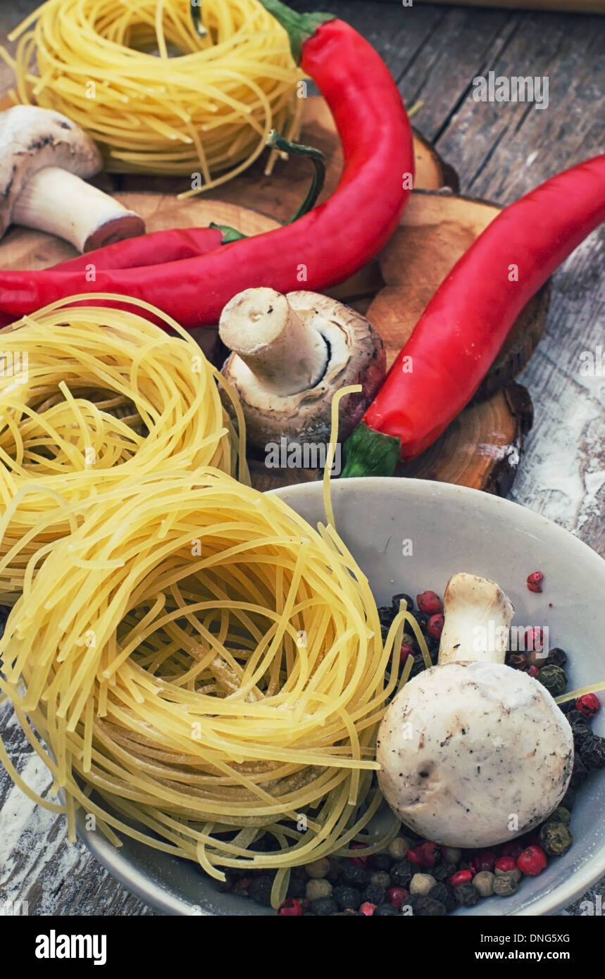 raw pasta on the kitchen table Stock Photo - Alamy
