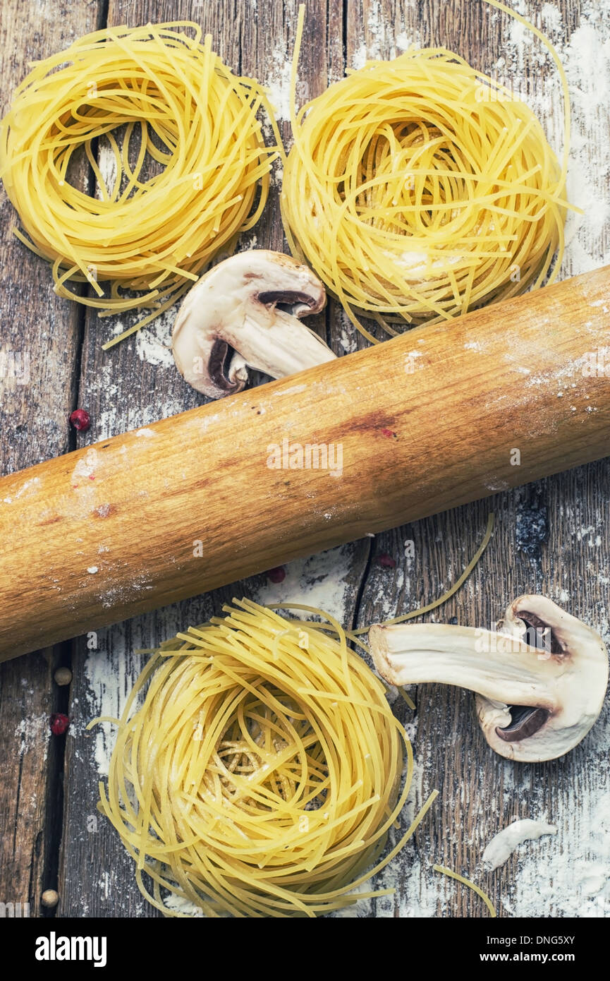 raw pasta on the kitchen table Stock Photo - Alamy