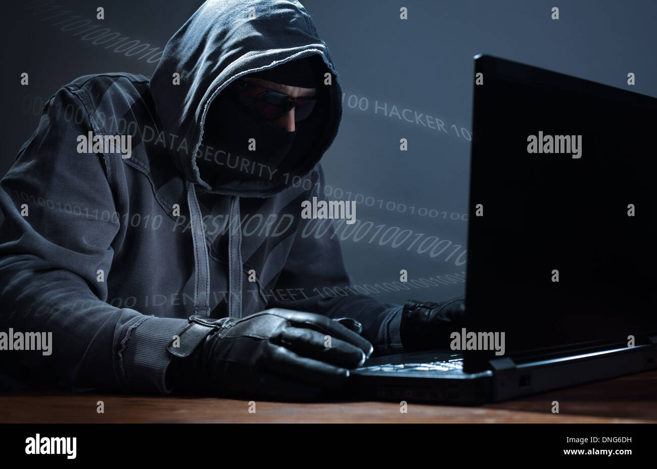 Hacker stealing data from a laptop Stock Photo - Alamy