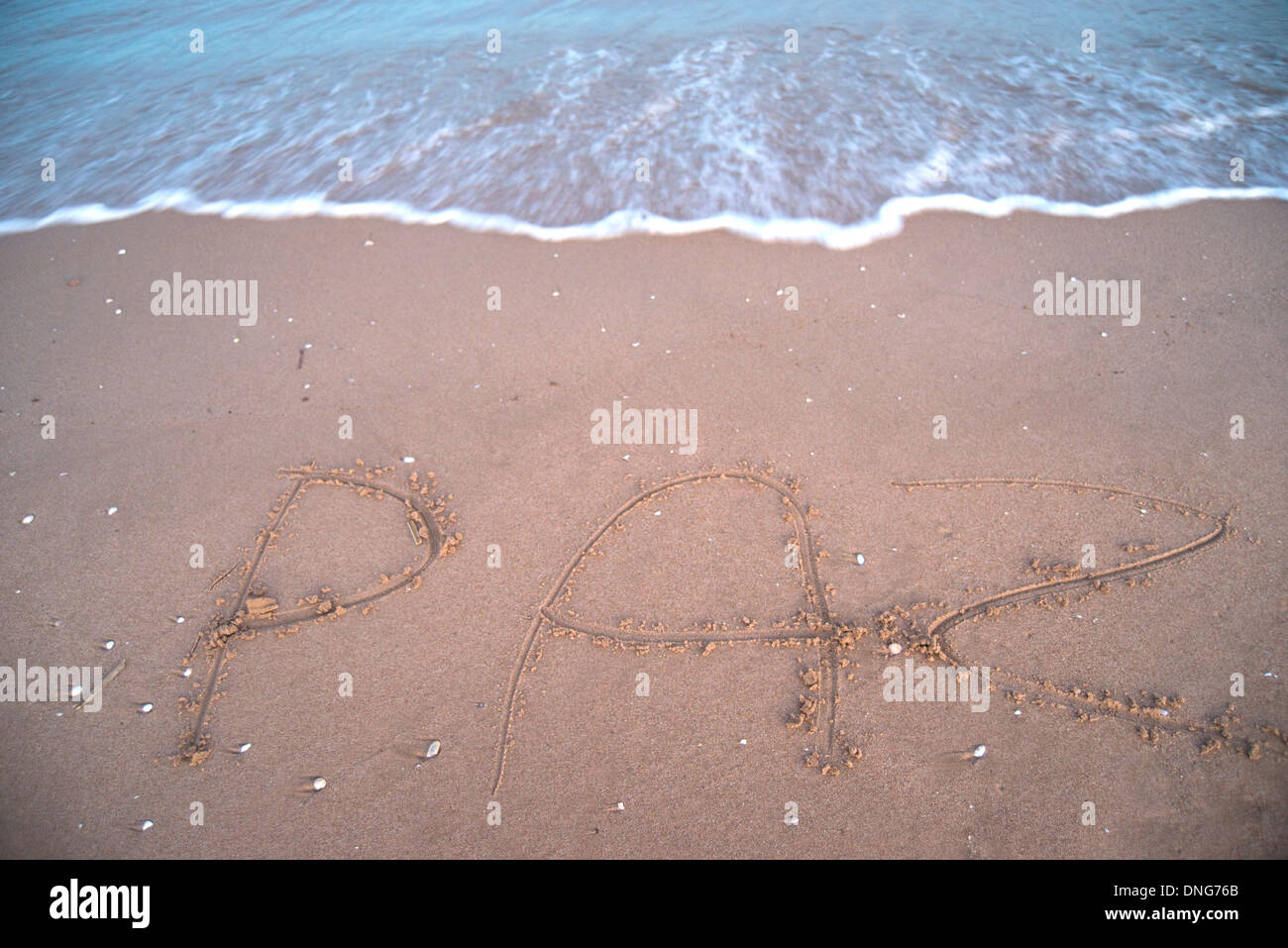 Word peace written in the sand Stock Photo - Alamy