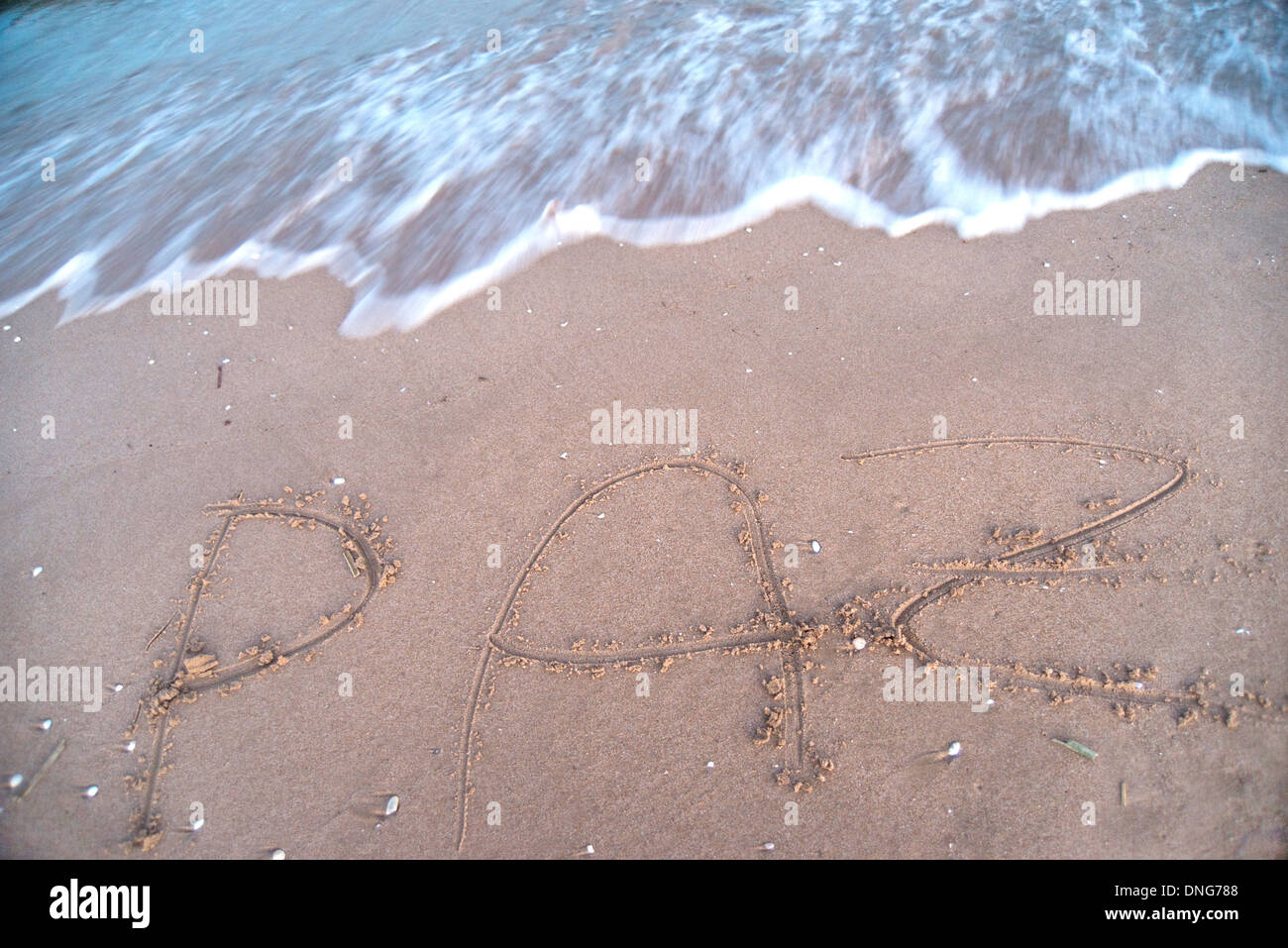 Word peace written in the sand Stock Photo - Alamy