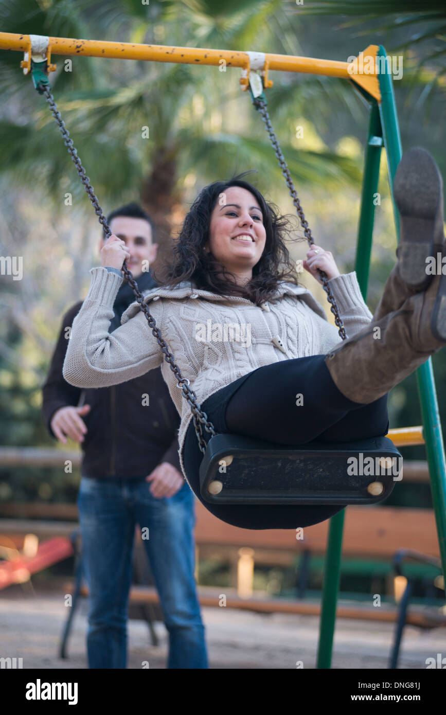 Couple playing on swing hi-res stock photography and images - Alamy