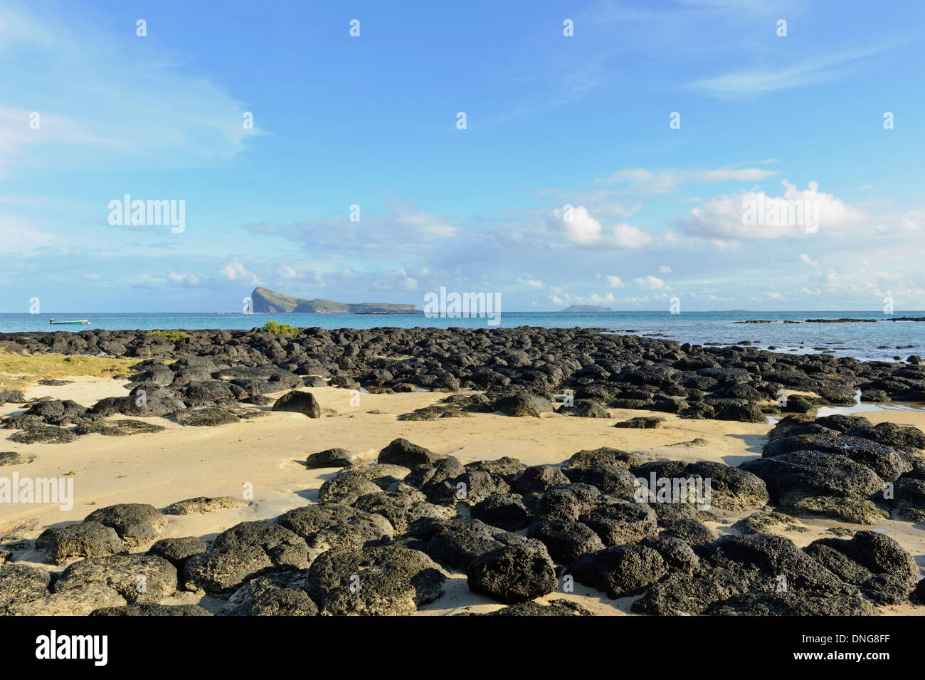 Scenic view of Coin de Mire island and fishing boats, Mauritius Stock ...