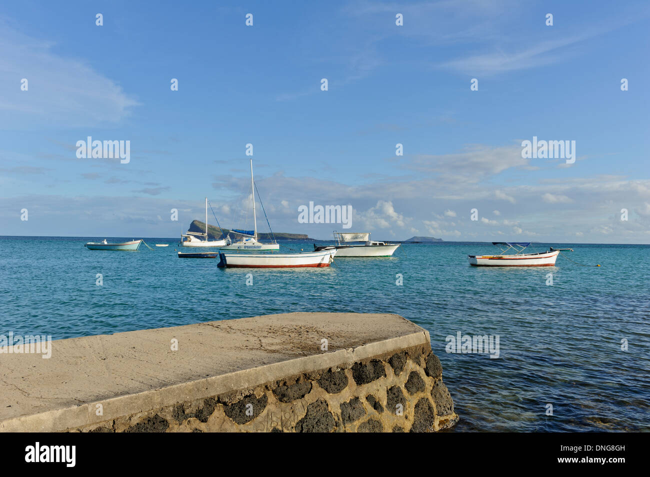 Scenic view of Coin de Mire island and fishing boats, Mauritius Stock ...