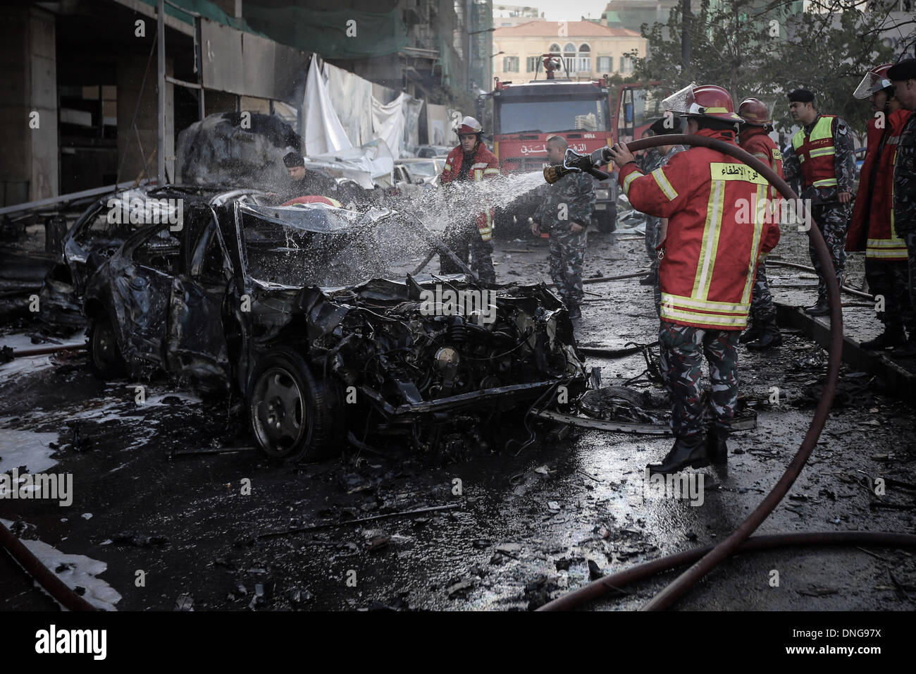Beirut, Lebanon. 27th Dec, 2013. A Lebanese firefighter extinguishes ...